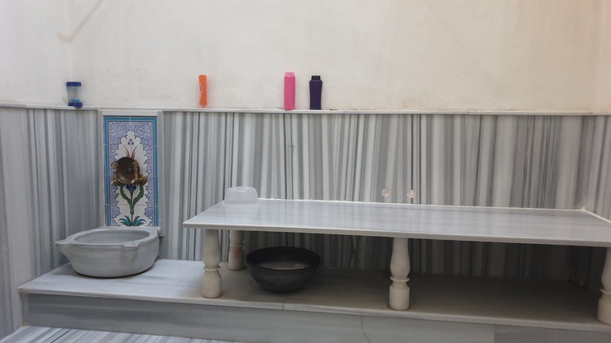 A 500-year-old Turkish bath, or hammam, serves people the traditional ...